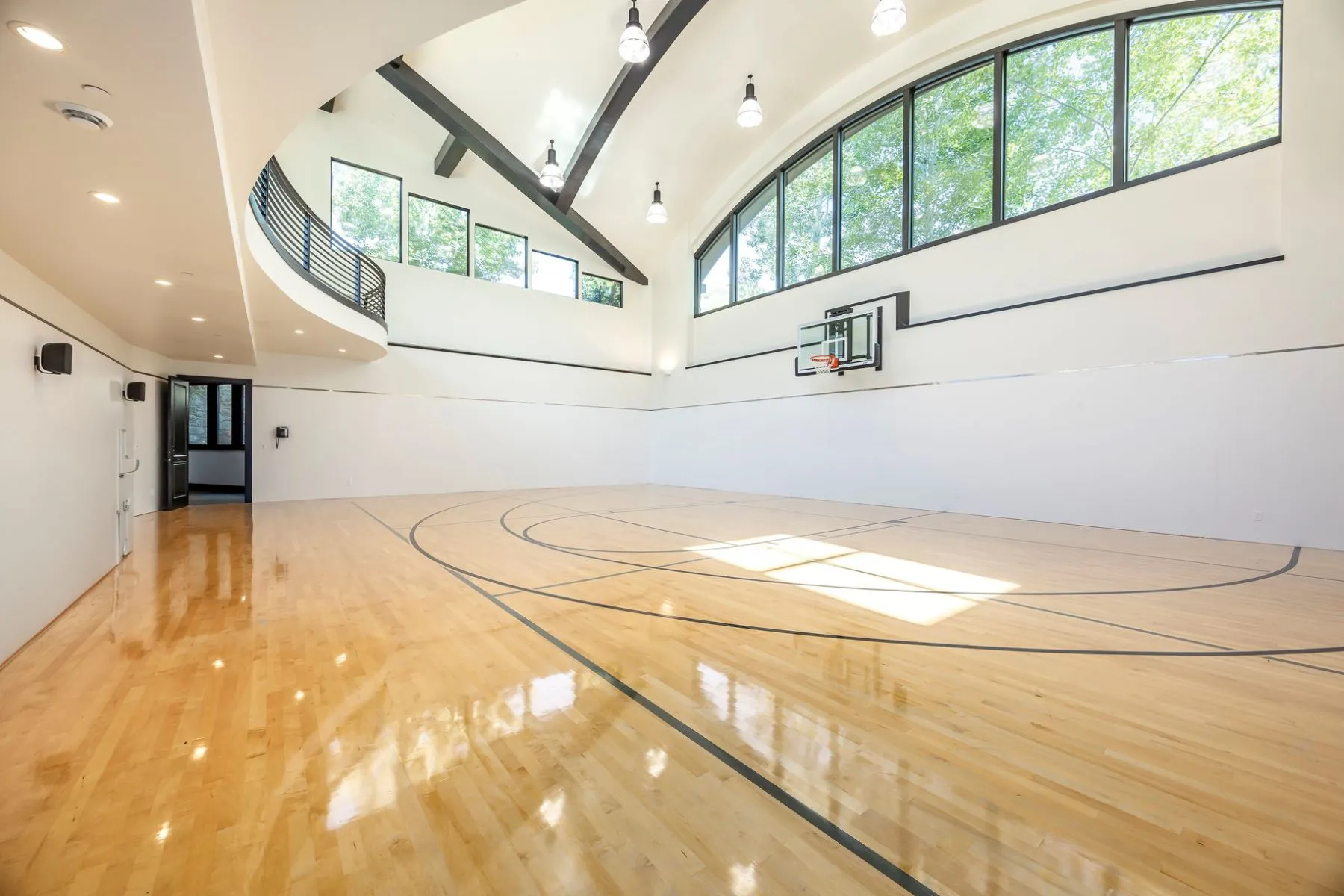A Look Inside Luxury Homes Featuring Indoor Basketball Courts